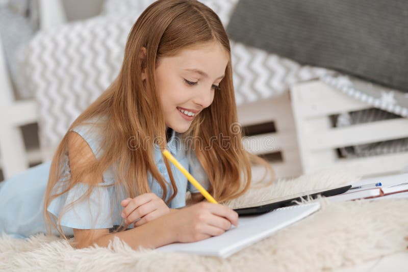 Adorable Kid Writing in Notebook while Studying at Home Stock Photo ...