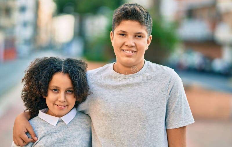 Adorable Latin Brother and Sister Hugging at the Park Stock Photo ...