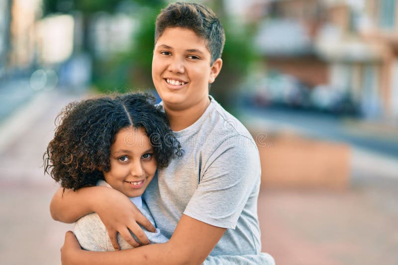Adorable Latin Brother and Sister Hugging at the Park Stock Image ...