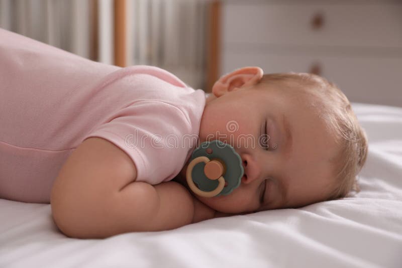 Adorable Little Baby with Pacifier Sleeping on Bed at Home Stock Image ...