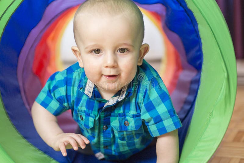 Adorable Little Boy Playing Inside a Toy Tunnel Stock Photo - Image of ...