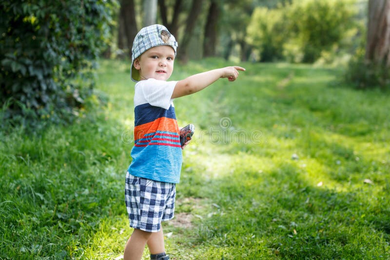 Adorable Little Boy Pointing at Something Stock Photo - Image of ...