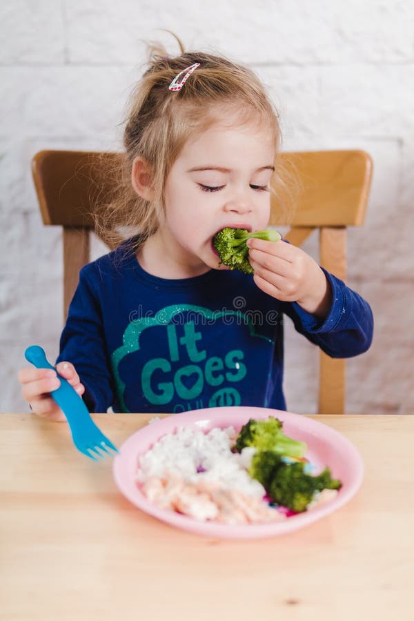 Adorable Little Girl Eating Lunch Stock Photo - Image of laugh, girl ...