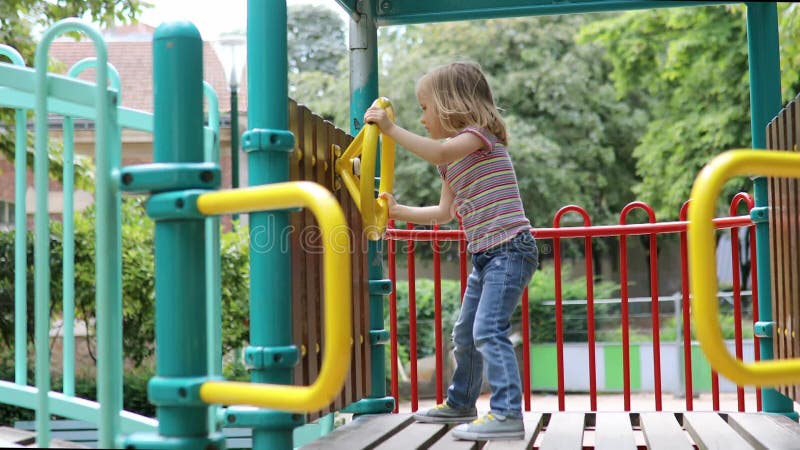 Adorable Little Girl on Playground on a Sunny Day Stock Video - Video ... Adorable Little Girl on Playground on a Sunny Day Stock Video - Video ...