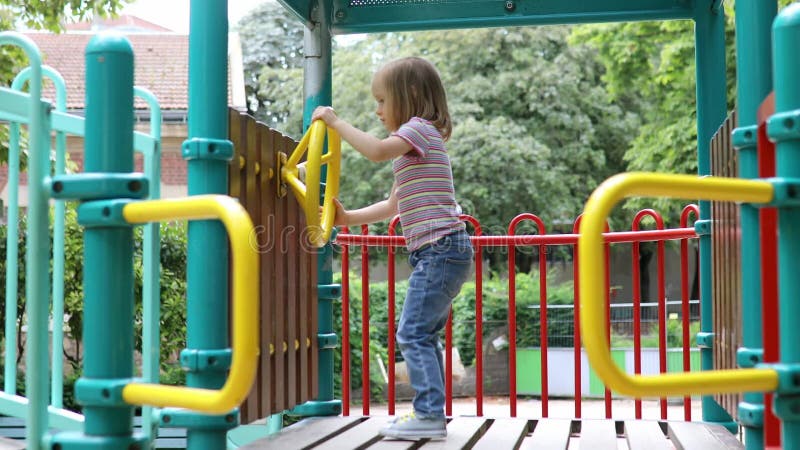Adorable Little Girl on Playground on a Sunny Day Stock Video - Video ... Adorable Little Girl on Playground on a Sunny Day Stock Video - Video ...
