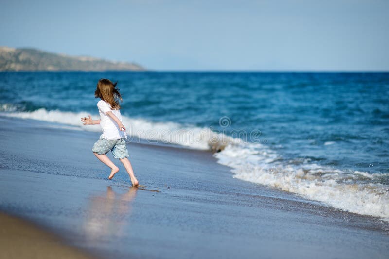 Adorable Little Girl on a Sandy Beach Stock Image - Image of sand ...