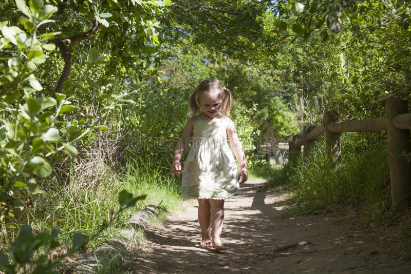 Adorable Little Girl Walking Down Path Stock Image - Image of hair ...