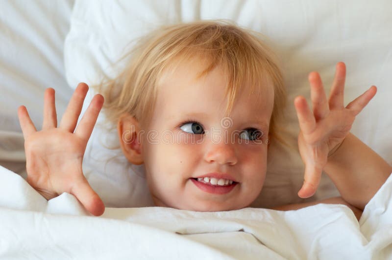 Adorable Little Girl in White Bed Stock Photo - Image of morning ...