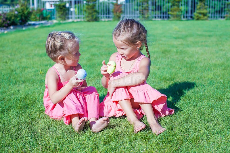 Adorable Little Girls Having Fun with Easter Eggs Stock Photo - Image ...