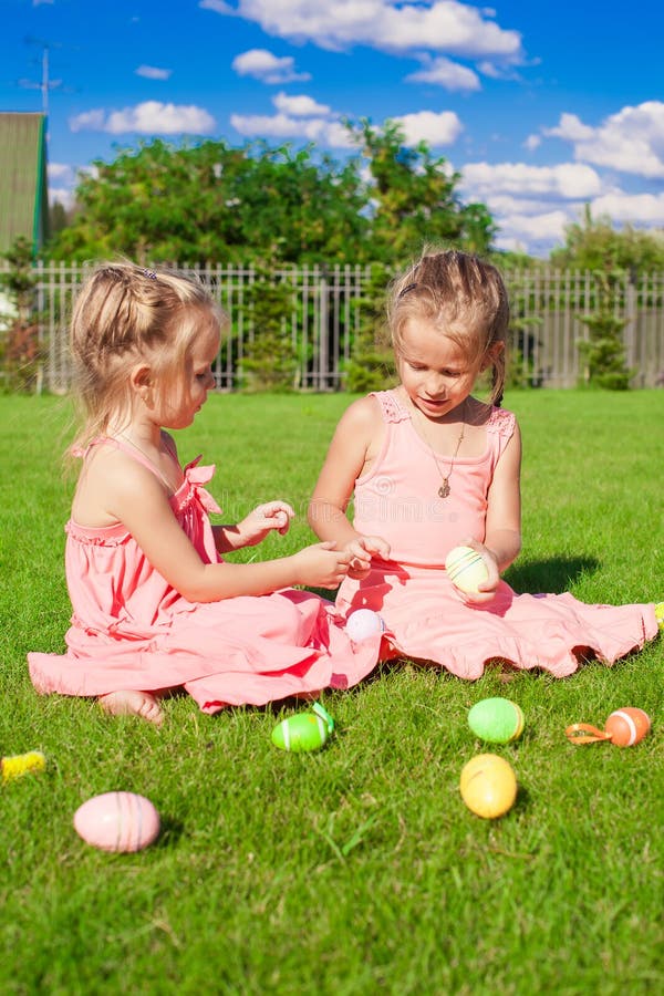 Adorable Little Girls Having Fun with Easter Eggs Stock Photo - Image ...