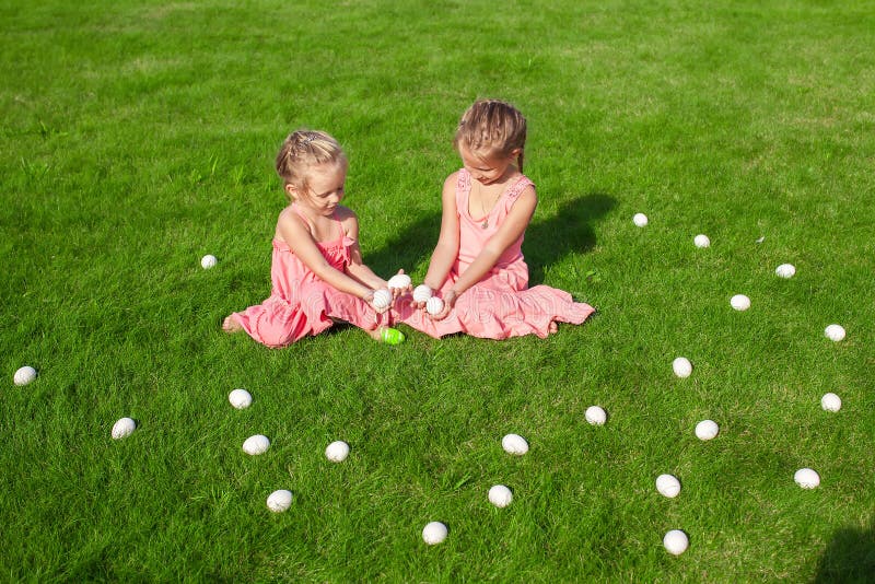Adorable Little Girls Having Fun with Easter Eggs Stock Image - Image ...