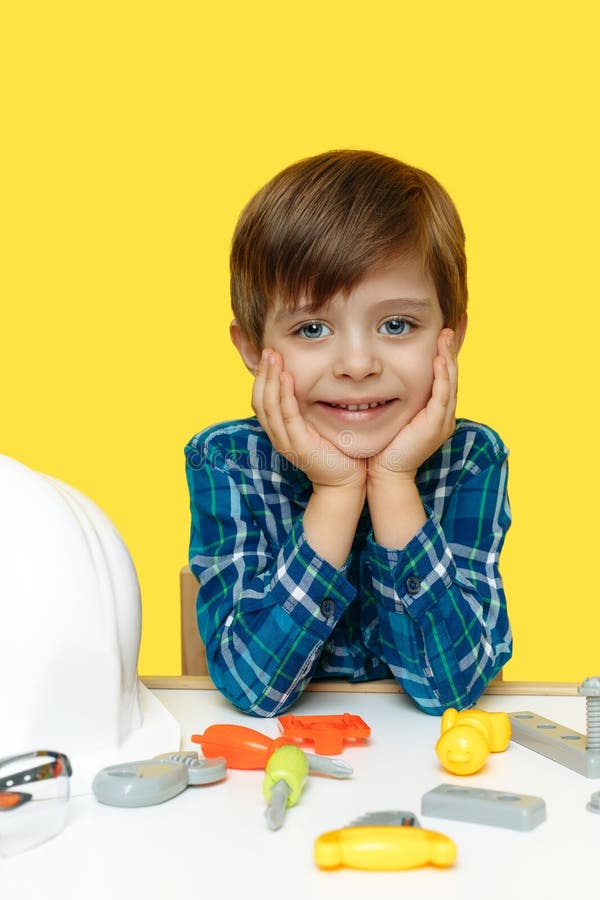 Adorable Little Kid Boy Engineer or Architect Sitting at the Work Table ...