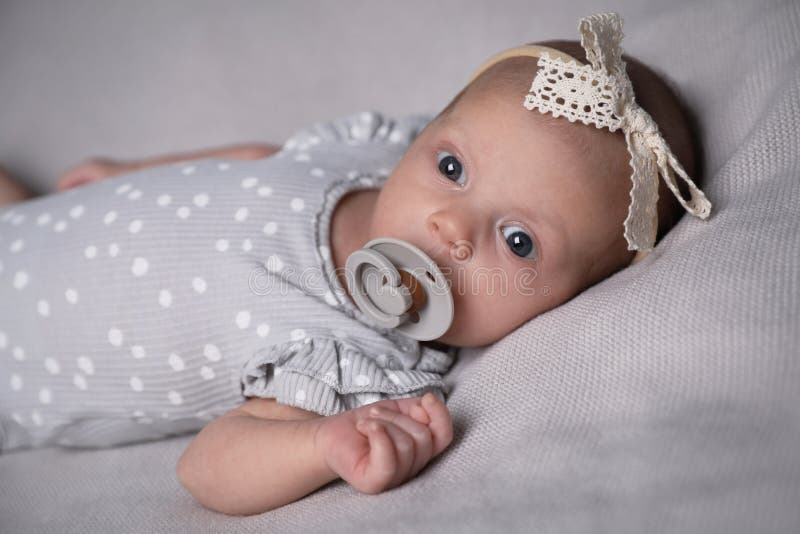 Adorable Baby with Pacifier on Bed Stock Photo - Image of clothes ...