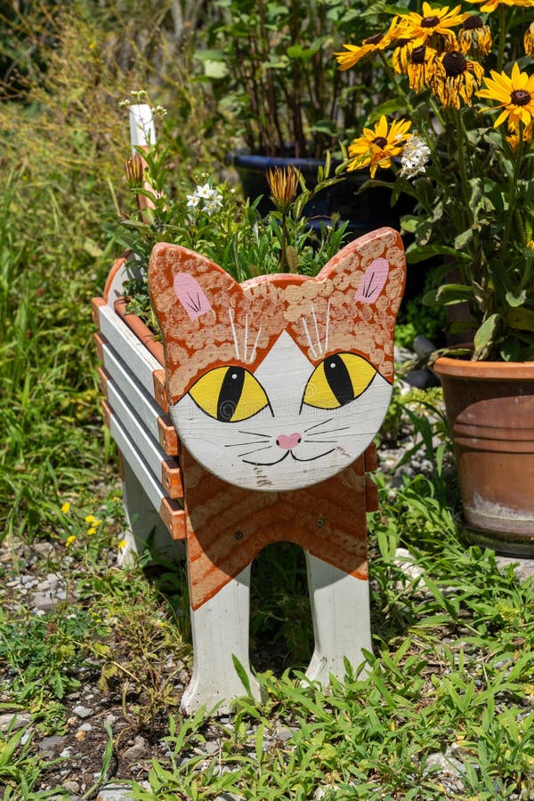 Adorable Orange Cat Flower Planter on a Patio Stock Image - Image of ...