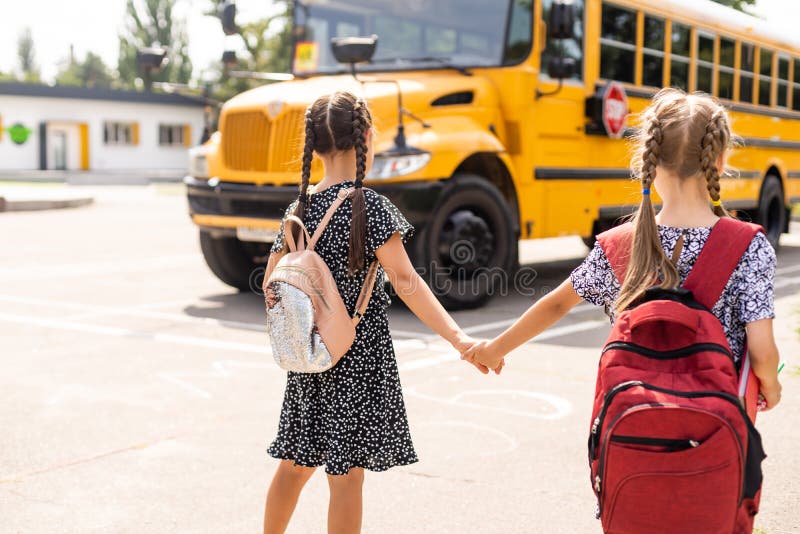 Adorable Schoolchildren Running To School Bus Stock Photo - Image of ...
