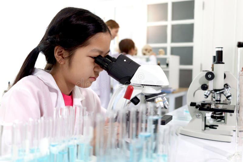 Adorable Schoolgirl in Lab Coat Doing Science Experiments, Young ...