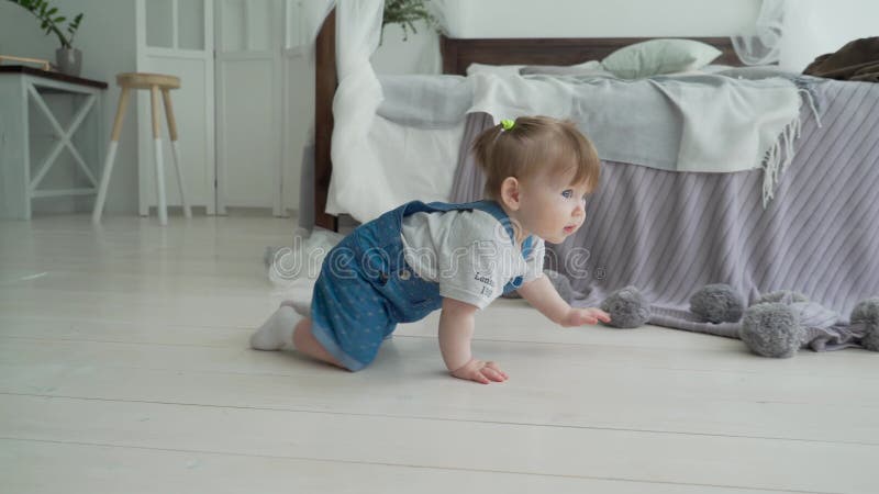 Adorable Smiling Baby Crawling on Floor Towards the Camera Stock ...