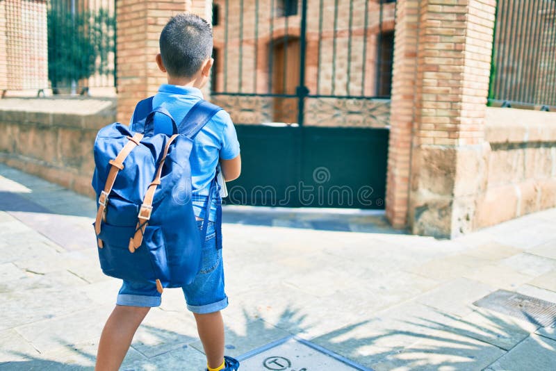 Adorable Student Boy on Back View Wearing Backpack at Street of City ...
