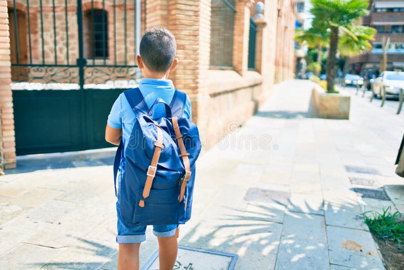 Adorable Student Boy on Back View Wearing Backpack at Street of City ...