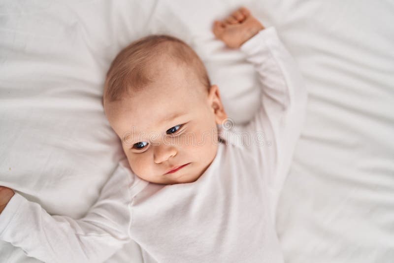 Adorable Toddler Lying on Bed at Bedroom Stock Photo - Image of ...