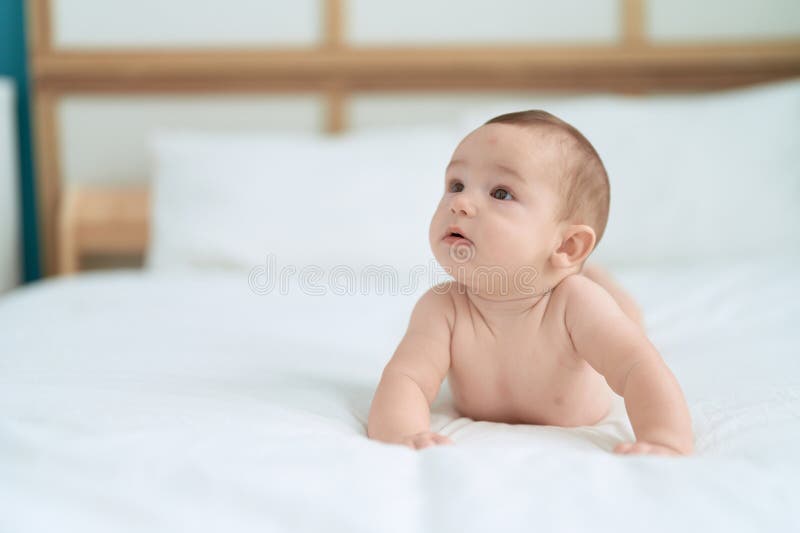 Adorable Toddler Lying on Bed with Relaxed Expression at Bedroom Stock ...