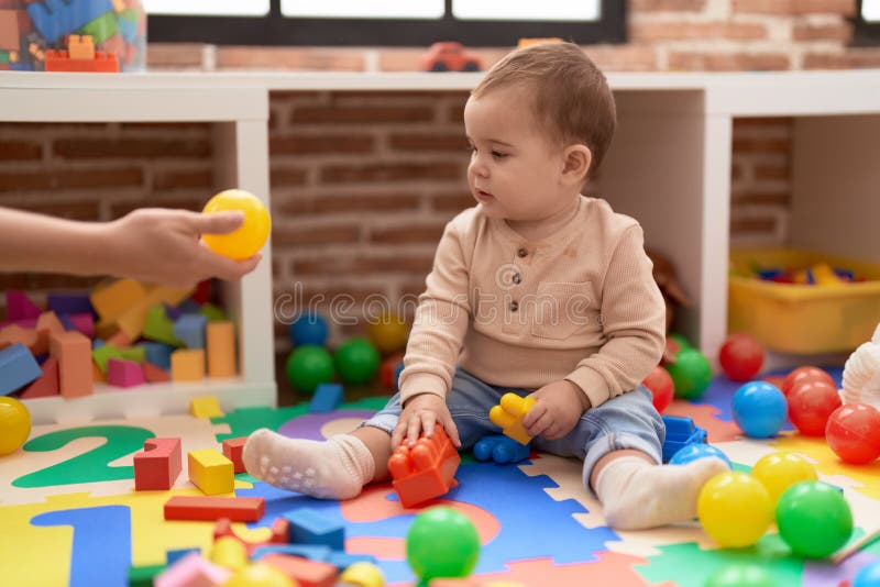 Adorable Toddler Playing with Plastic Construction Blocks Looking Ball ...
