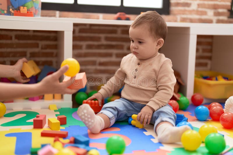 Adorable Toddler Playing with Plastic Construction Blocks Looking Ball ...