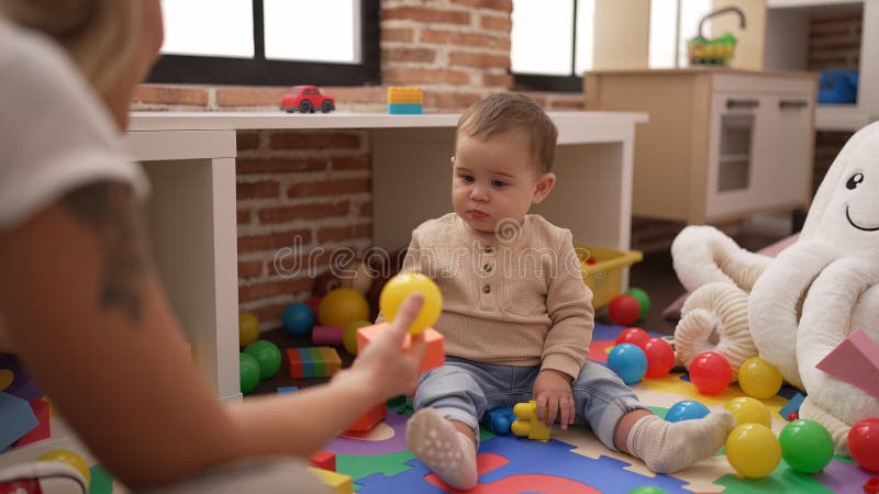 Adorable Toddler Playing with Plastic Construction Blocks Looking Ball ...