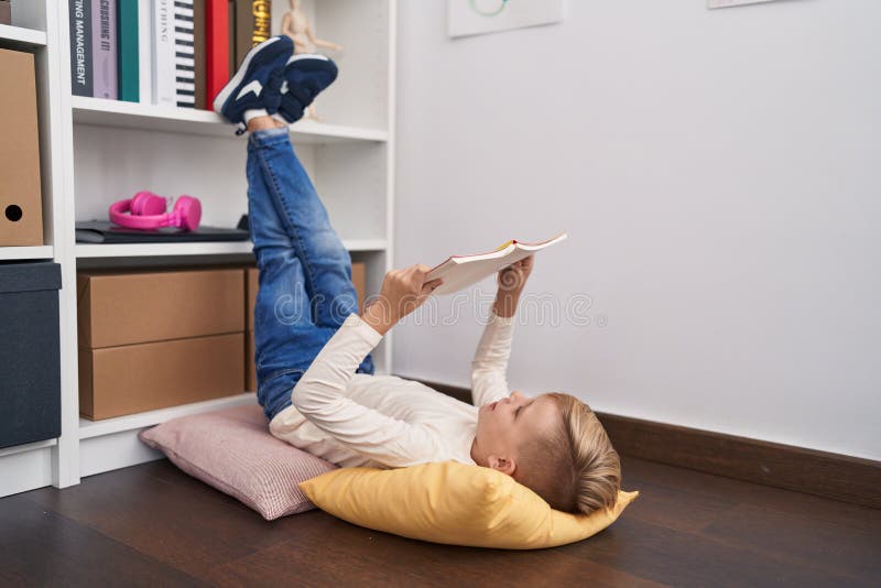 Adorable Toddler Reading Book Lying on Floor at Home Stock Image ...