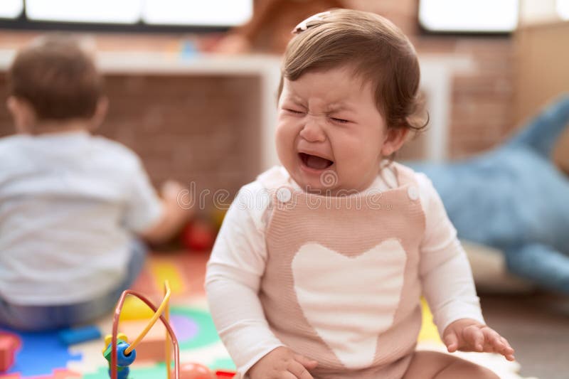 Adorable Toddler Sitting on Floor Crying at Kindergarten Stock Image ...