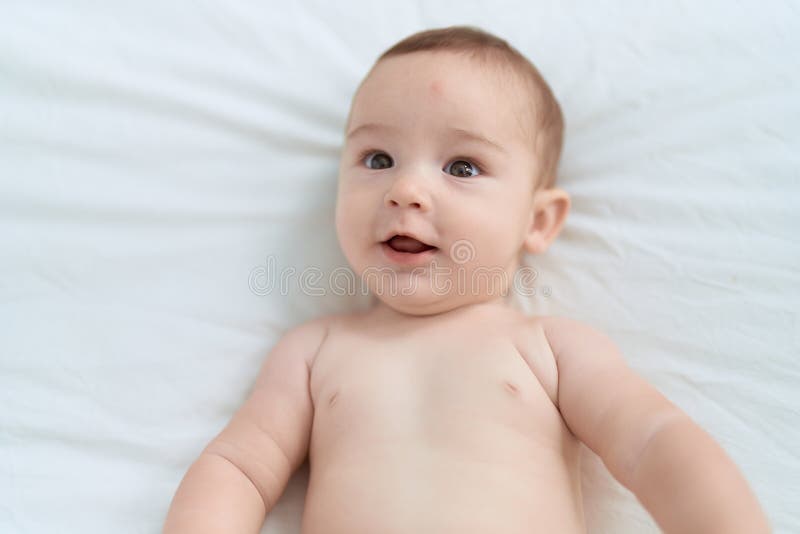 Adorable Toddler Smiling Confident Lying on Bed at Bedroom Stock Photo ...