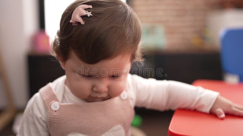 Adorable Toddler Standing with Relaxed Expression Leaning on Table at ...