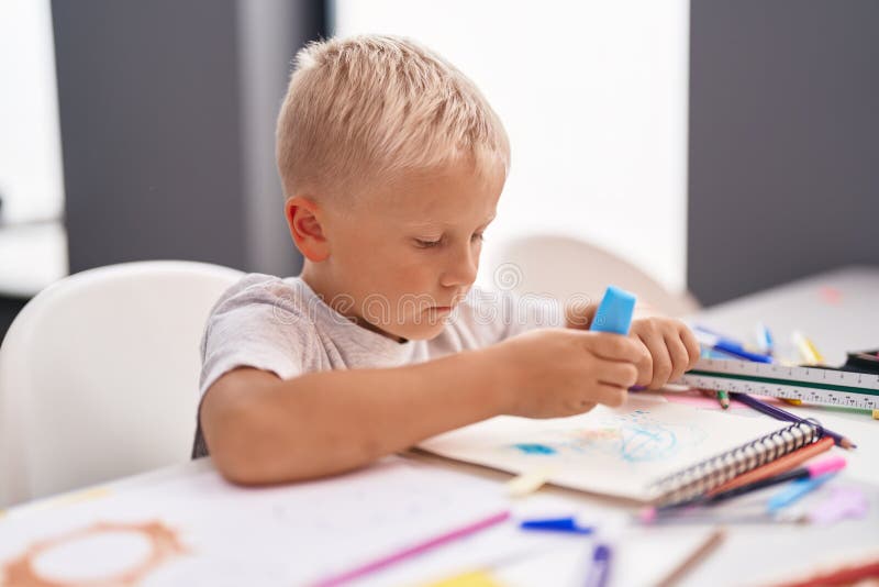 Adorable Toddler Student Drawing on Notebook Sitting on Table at ...