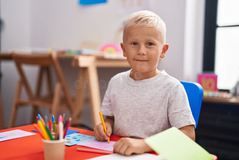 Adorable Toddler Student Drawing on Notebook Sitting on Table at ...