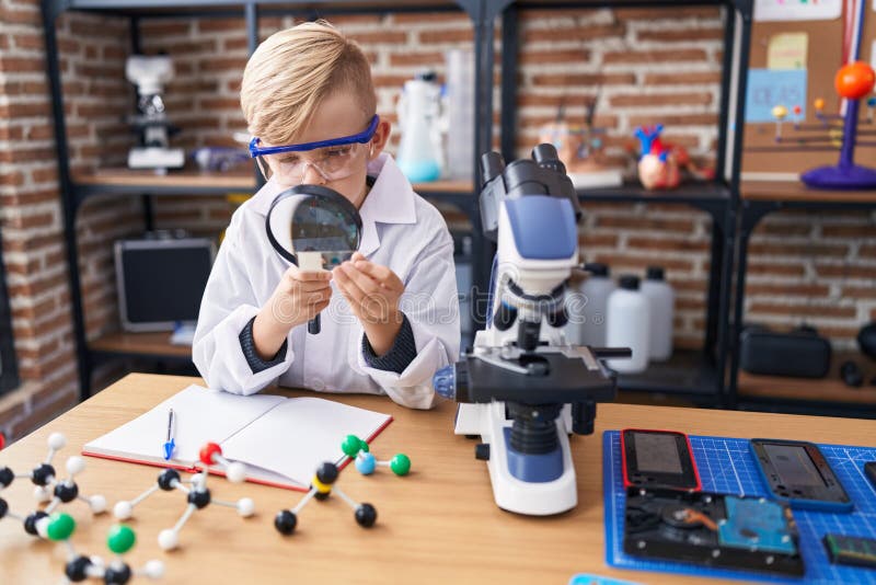 Adorable Toddler Student Looking Sample with Magnifying Glass at ...