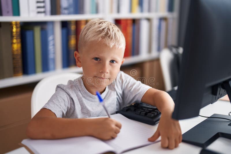 Adorable Toddler Student Using Computer Writing on Notebook at ...