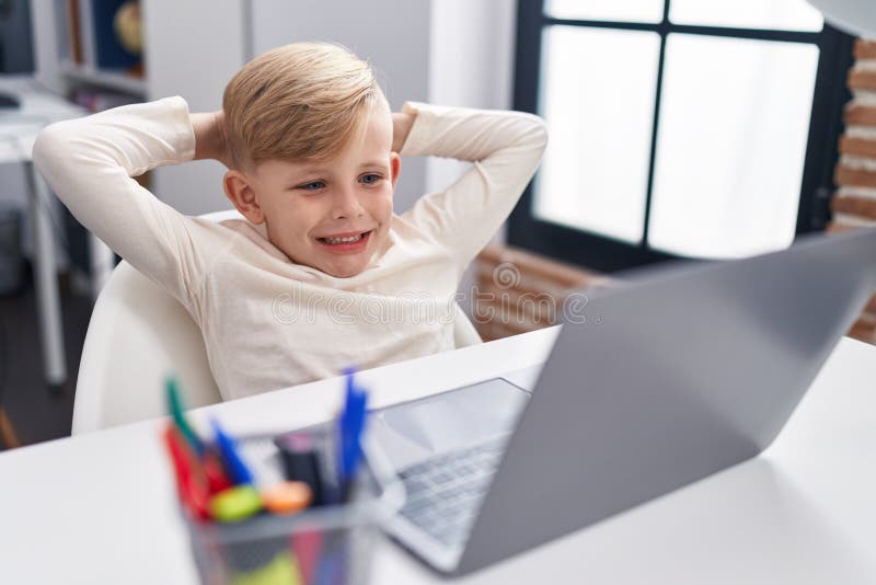 Adorable Toddler Student Using Laptop Relaxed on Table at Classroom ...