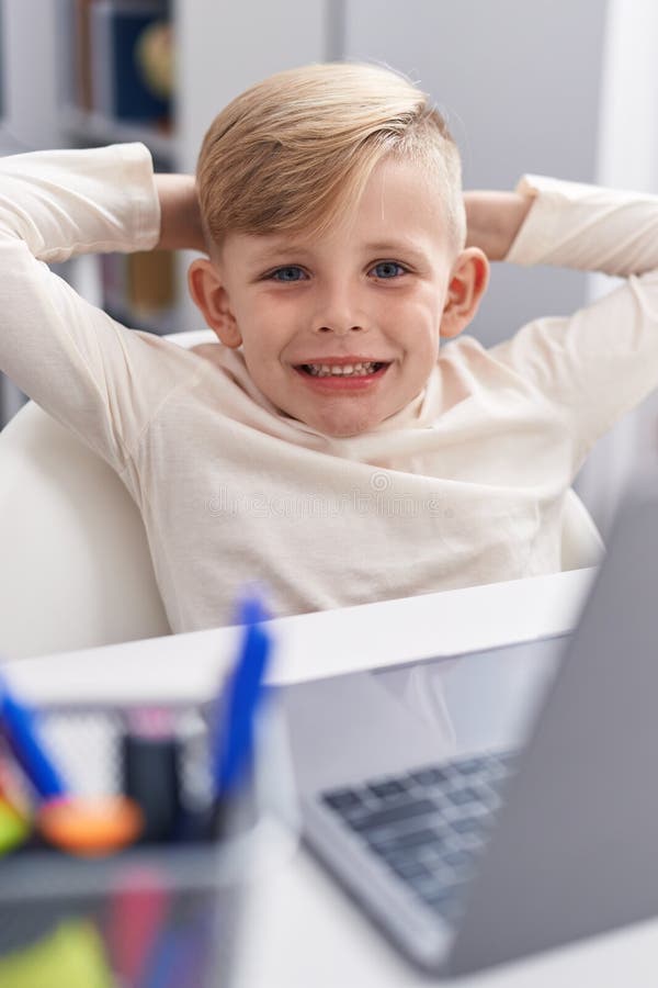 Adorable Toddler Student Using Laptop Relaxed on Table at Classroom ...