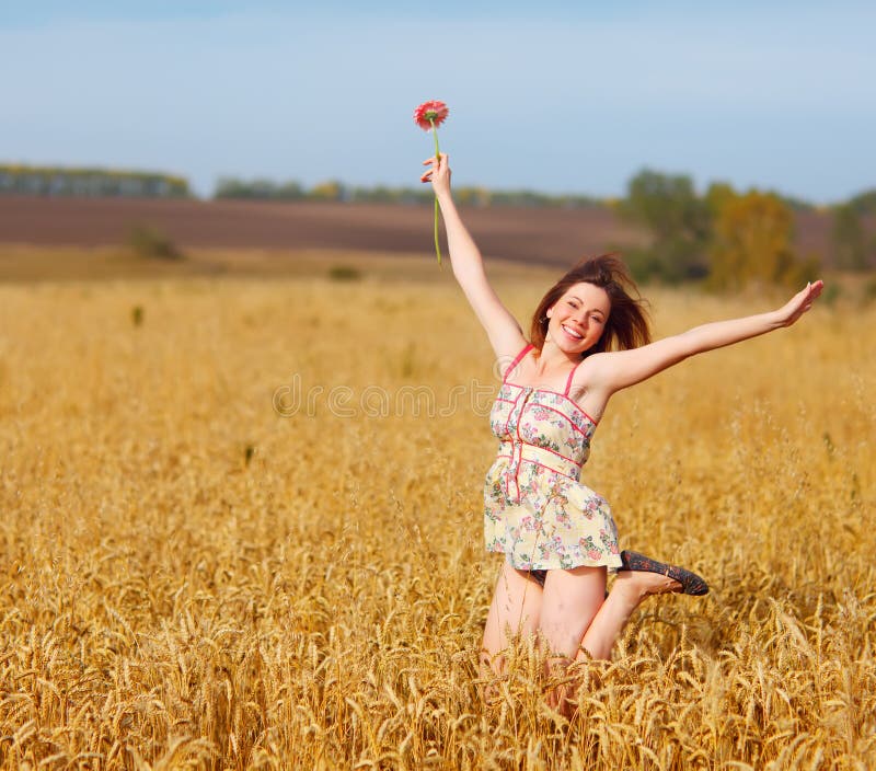 Adorable Woman in Field with Flower Stock Photo - Image of field ...