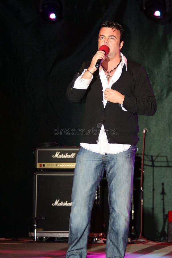 Adrian Enache Singing on a Stage in Front of the Spectators. Editorial ...