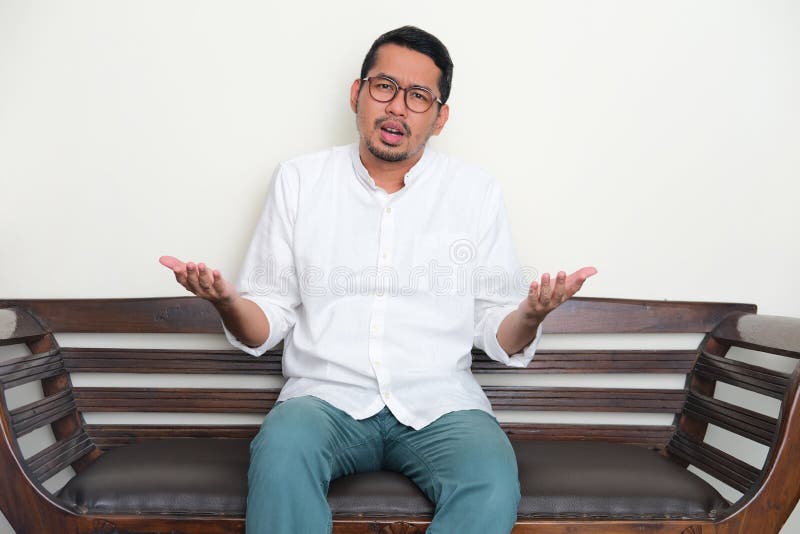 Adult Asian Man Sitting Couch Showing Confused Expression Stock Photos ...