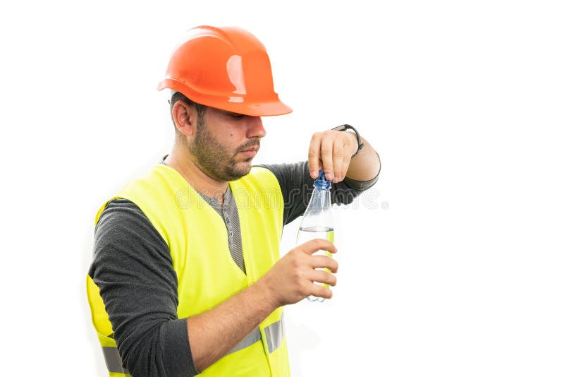 Builder Opening or Closing Plastic Water Bottle with Copyspace Stock ...