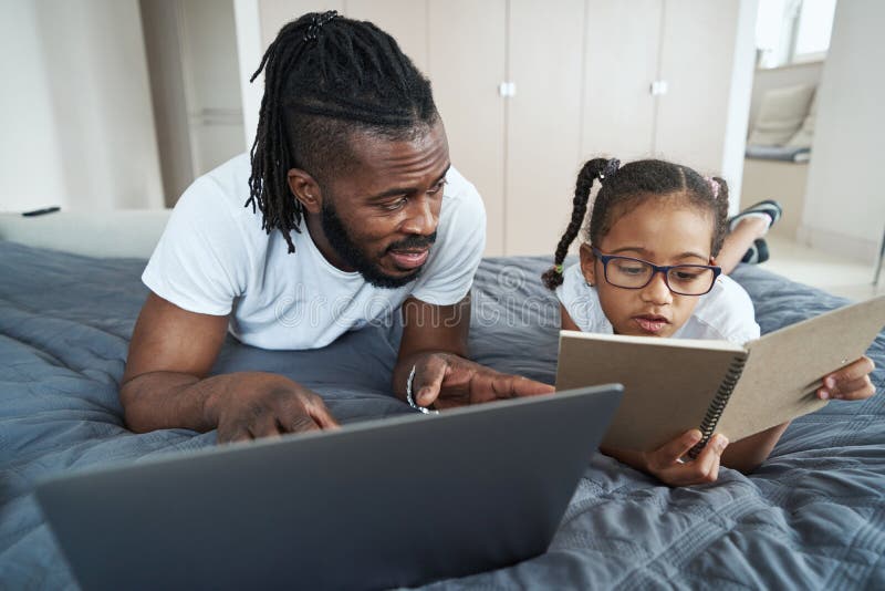 Adult Father with His Daughter Work and Study in Bed Stock Photo ...