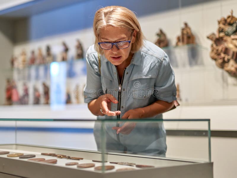 Adult Female Looking at Exhibit. Editorial Image - Image of exposition ...