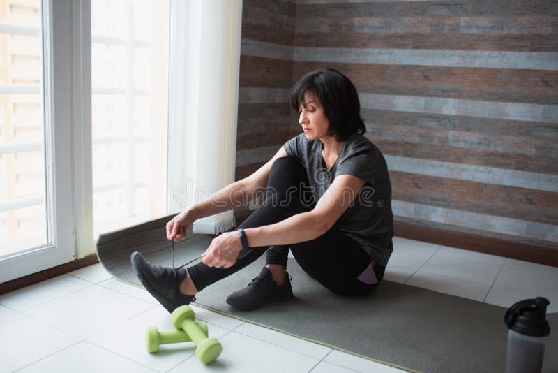 Adult Fit Slim Woman Has Workout At Home Serious Hardworking Mature