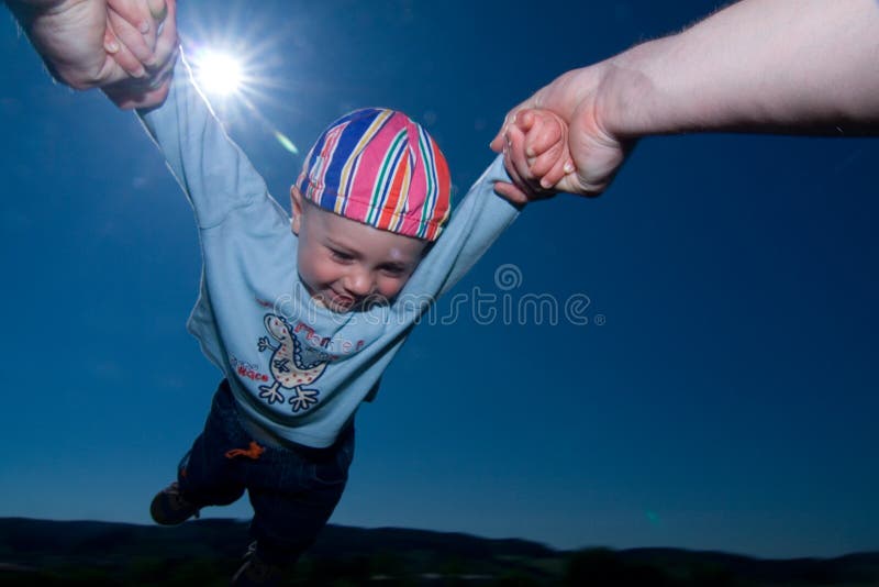 Adult Flying Young Child stock photo. Image of swinging - 2461010