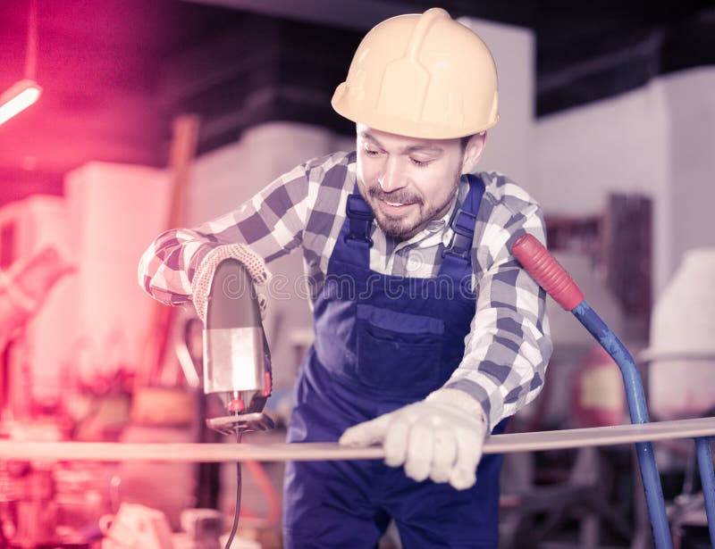 Adult Guy is Using Power Jigsaw for Construction Work Stock Photo ...