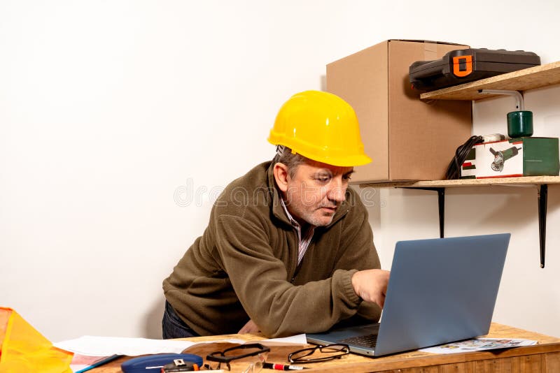 Adult Male. Engineer Checking Laptop in Work Office. Concept of Work ...