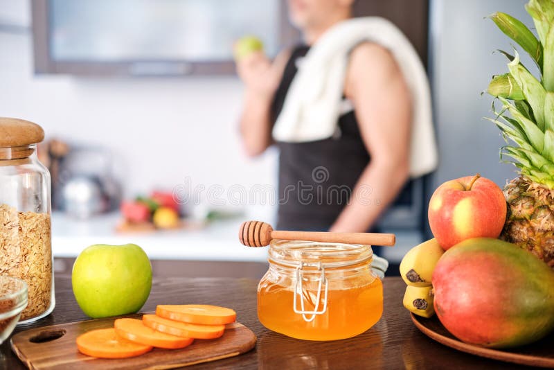 Adult Man is Eating an Apple after a Workout. Stock Photo - Image of ...