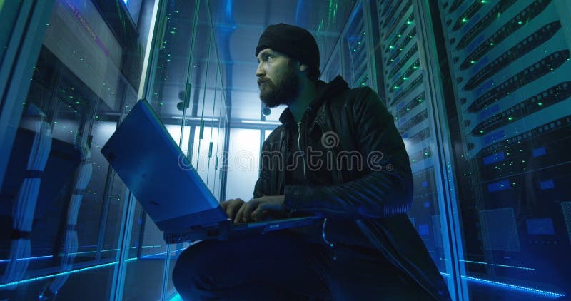 Adult Man Hacking Servers with Computer Stock Photo - Image of data ...